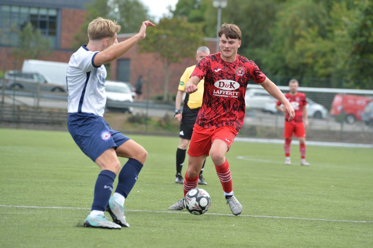 West Coast Today - Media Library - DB T37 Roy Garvie runs at Jake Wright 25 Oban Saints